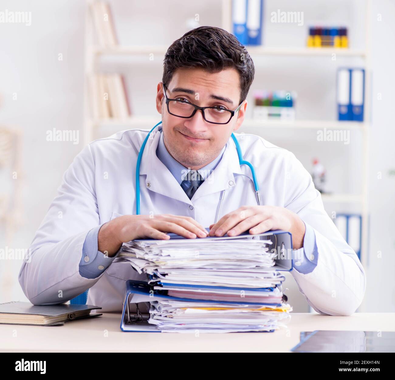 The busy doctor with too much work in hospital Stock Photo - Alamy