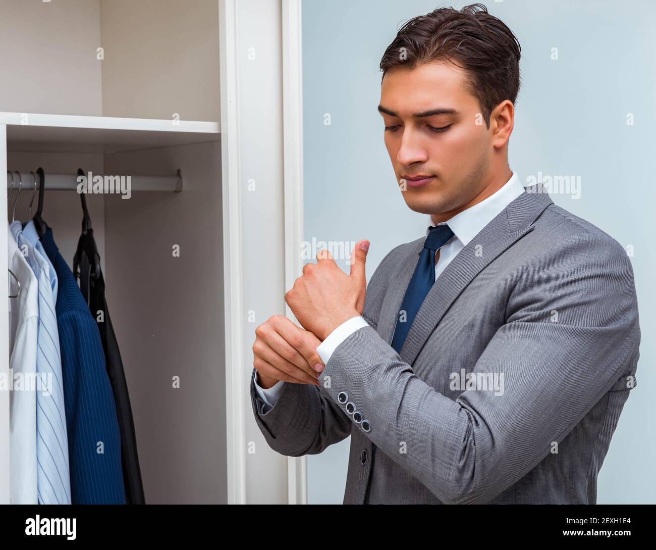 The businessman dressing up for work Stock Photo - Alamy