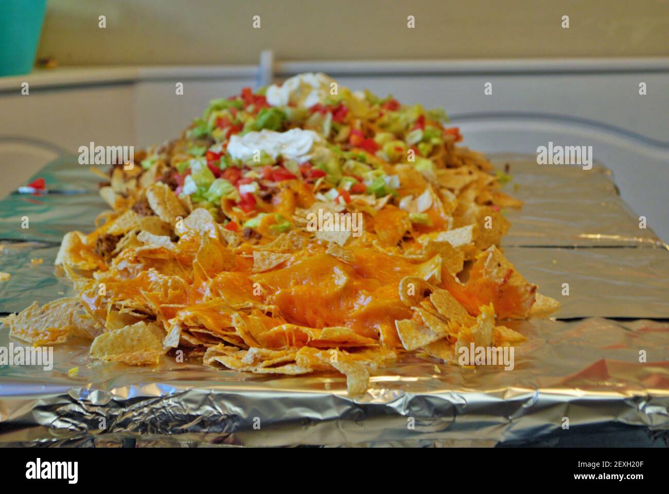 Nacho table kitchen table wrapped in aluminum foil and covered with ...