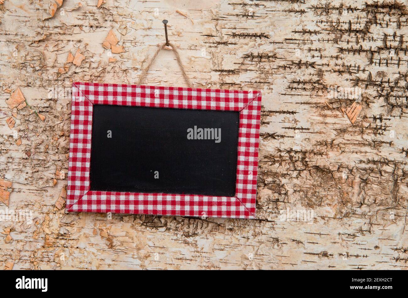 Small board on birch bark background Stock Photo - Alamy