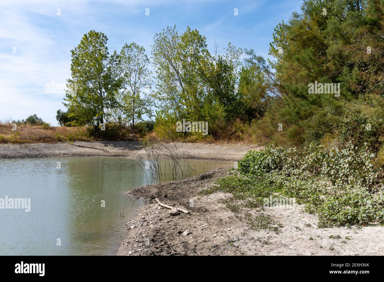 Stock photo of beautiful landscape of blue lake surrounded by big trees ...