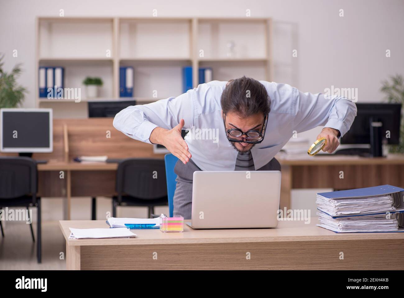 Young funny employee working at workplace Stock Photo - Alamy