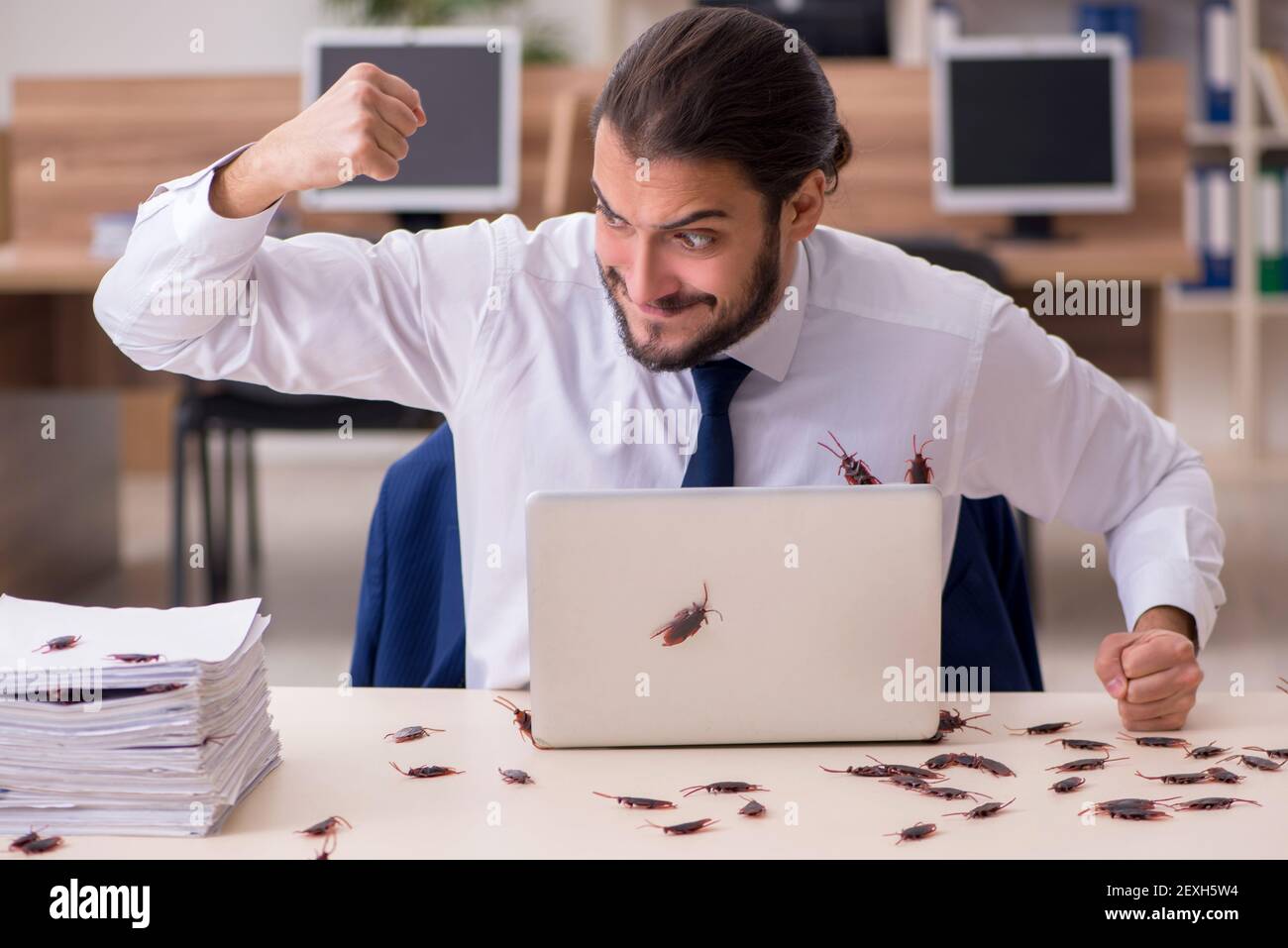 Young businessman employee and too many cockroaches in the office Stock ...