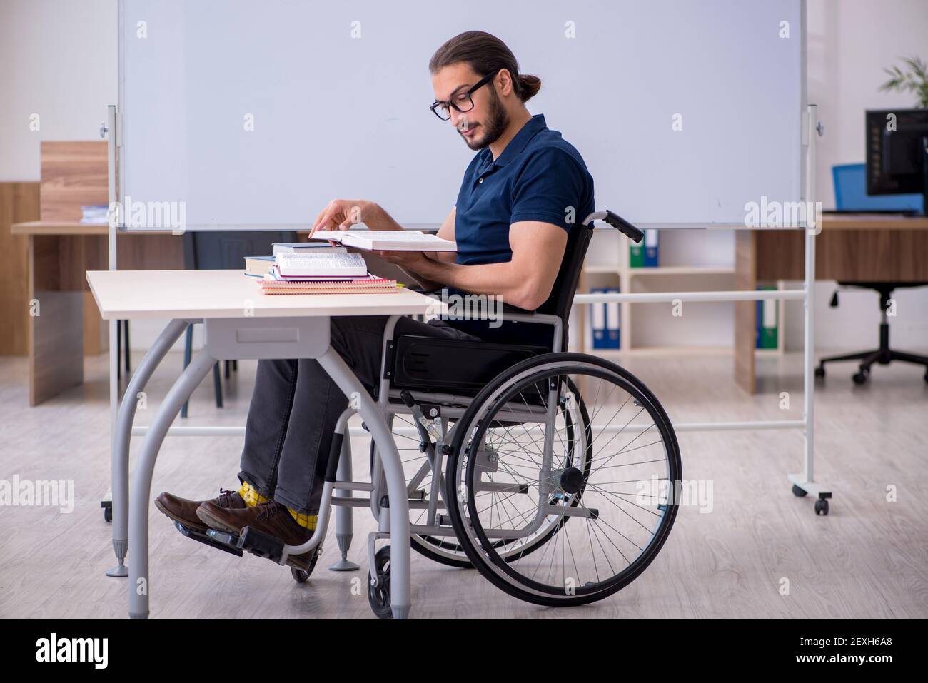 Young handicapped student in the classroom Stock Photo - Alamy