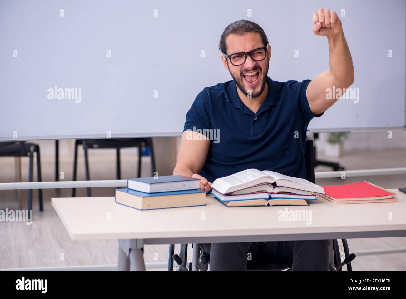 Young handicapped student in the classroom Stock Photo - Alamy