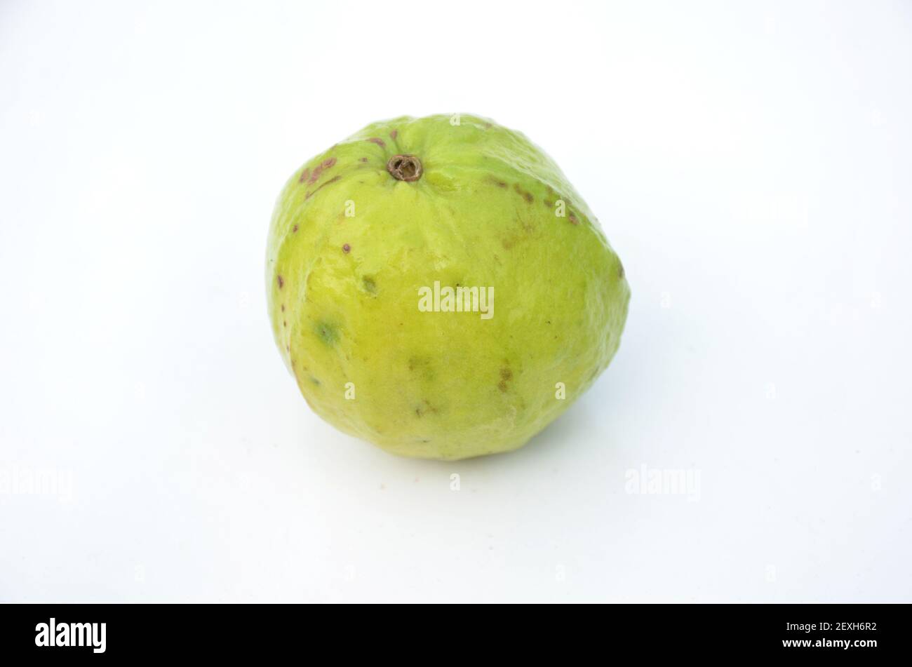 An organic guava fruit isolated on white background Stock Photo - Alamy