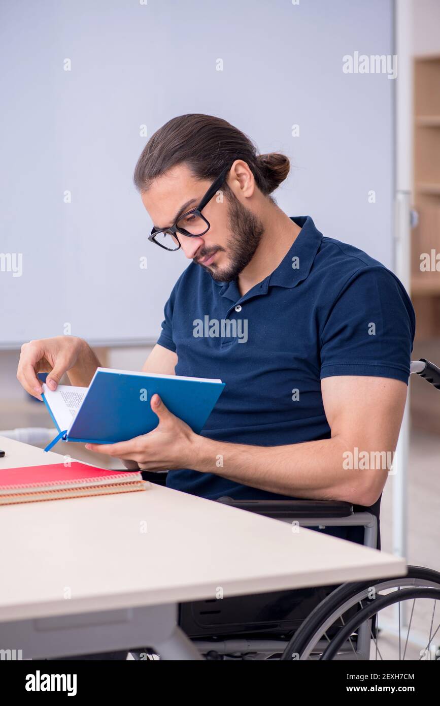 Young handicapped student in the classroom Stock Photo - Alamy