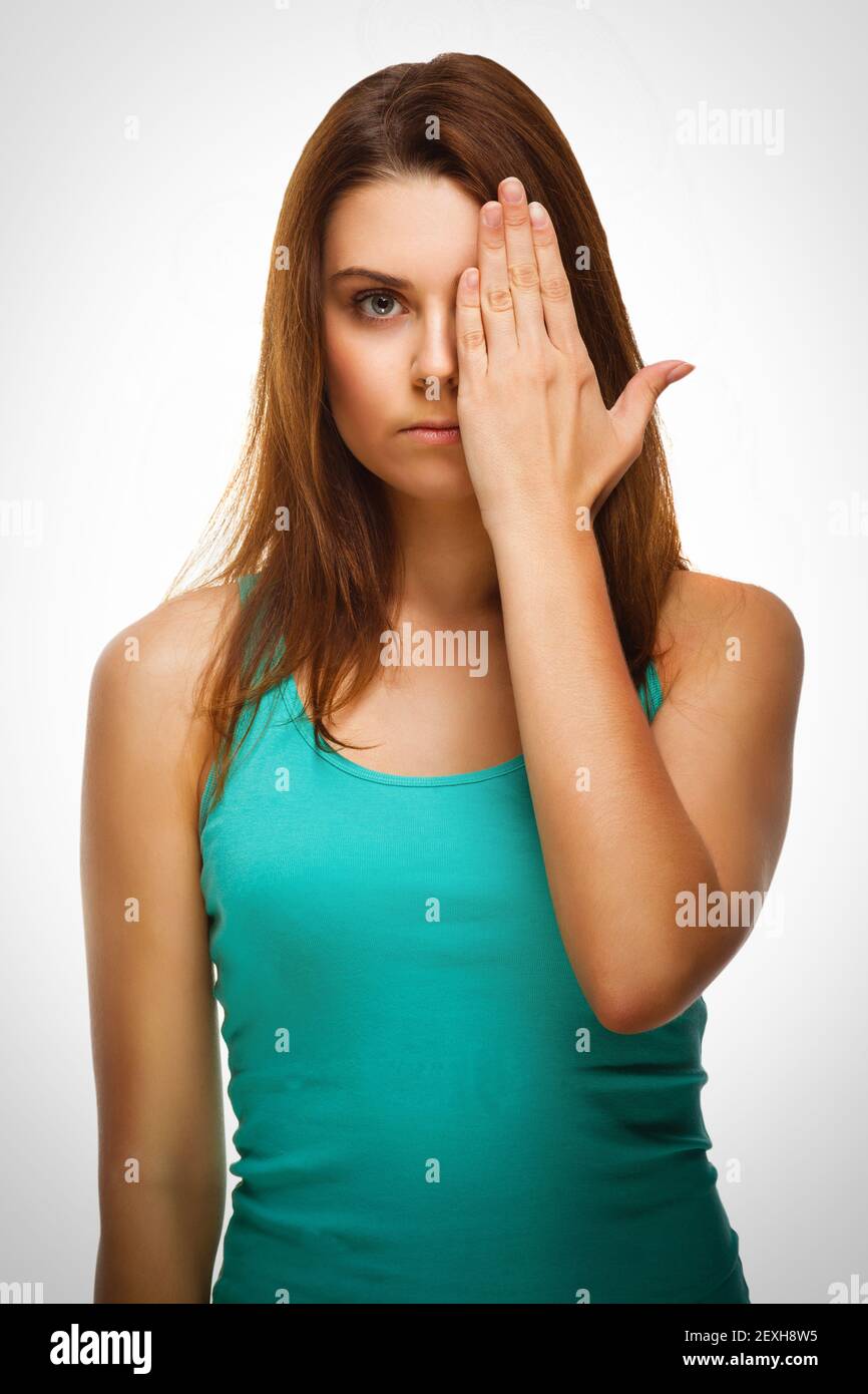 Woman brunette girl covered her face half hand Stock Photo - Alamy