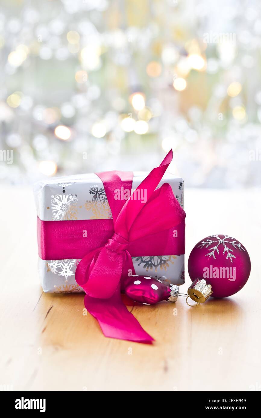 Small gift in front of bright lights Stock Photo - Alamy