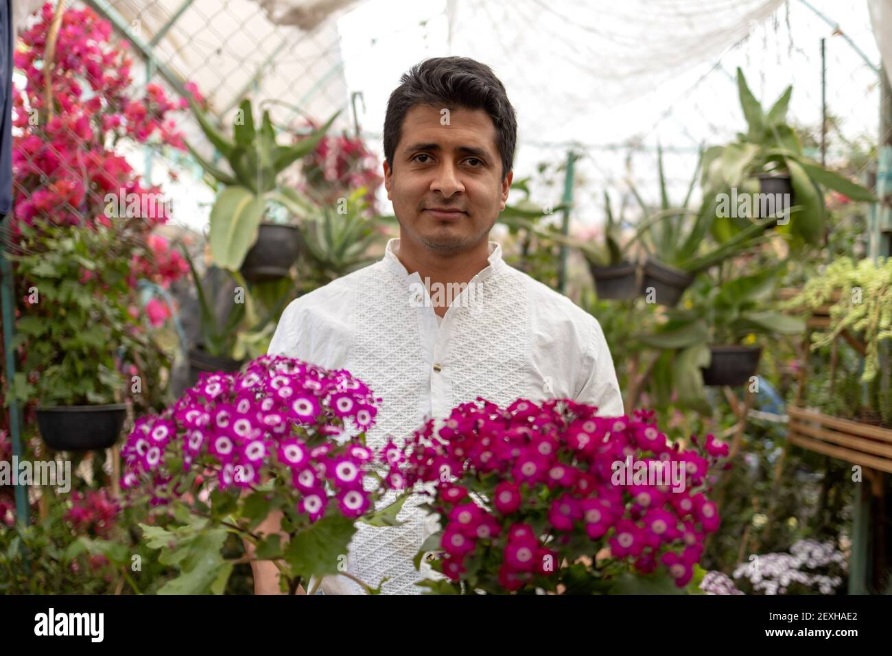 Nursery worker hispanic hi-res stock photography and images - Alamy