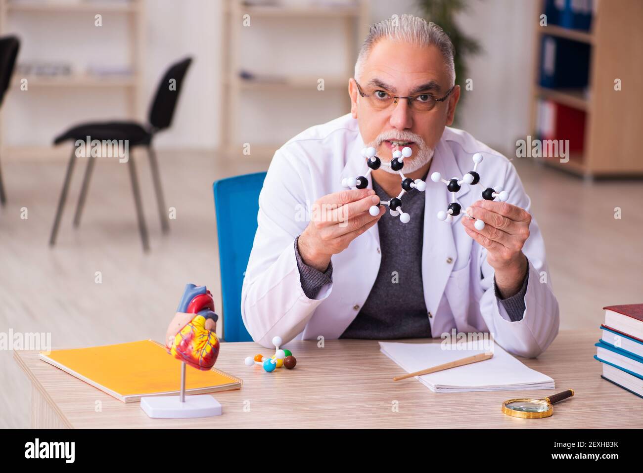 Old doctor cardiologist sitting in the classroom Stock Photo - Alamy