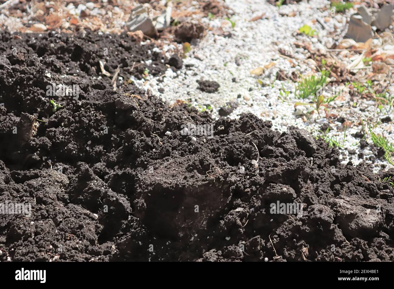 View of soil with part of it cultivated Stock Photo - Alamy