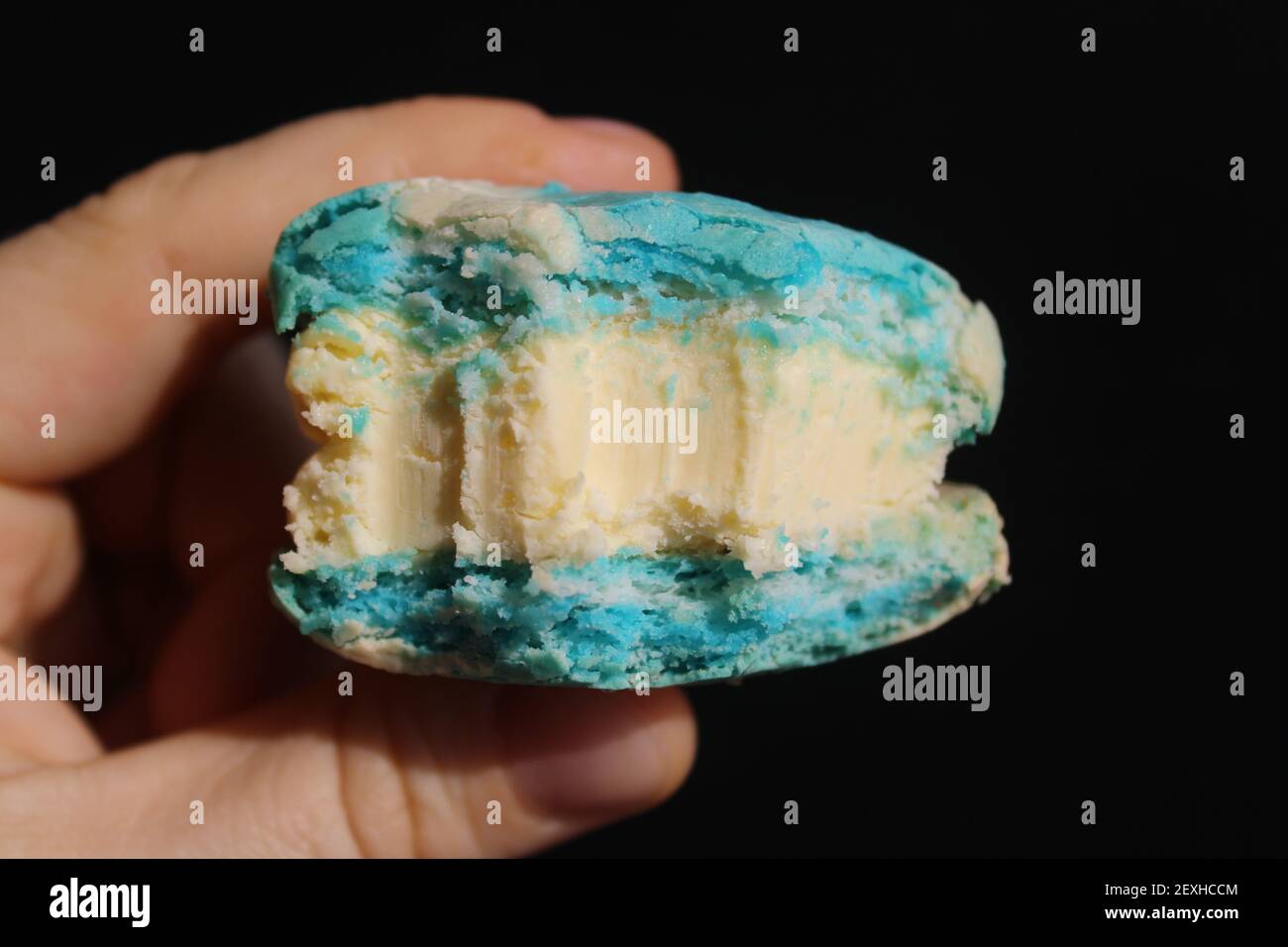 Hand holding macron hi-res stock photography and images - Alamy