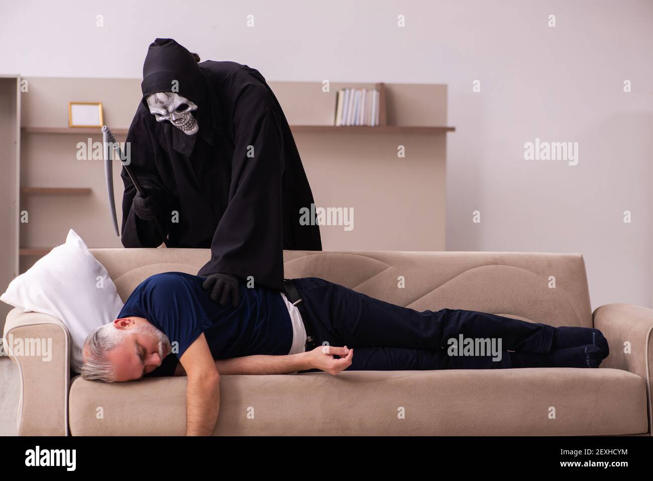 Devil coming to old dying man Stock Photo - Alamy