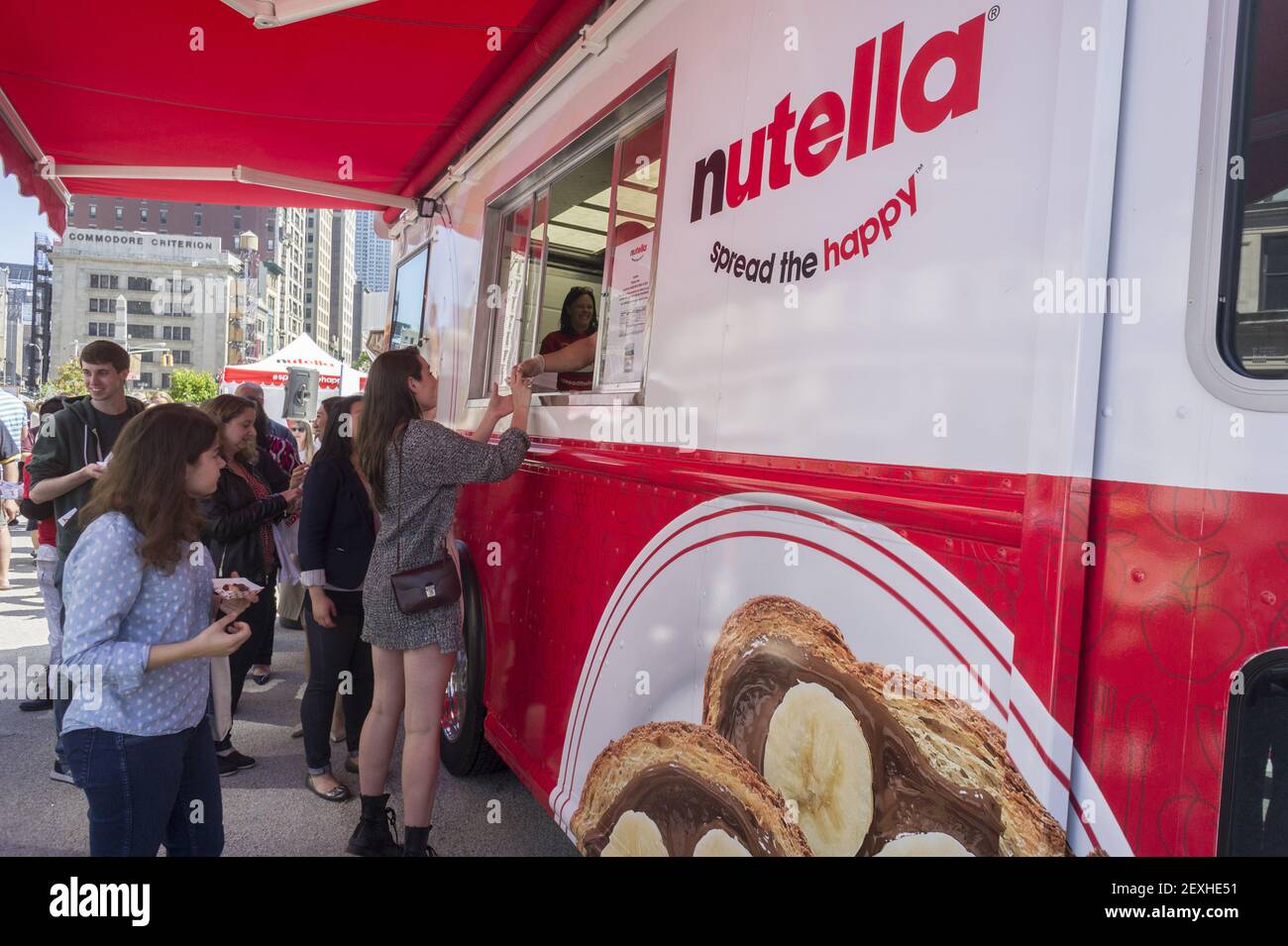 Consumers with their free samples at a Nutella branding event and ...