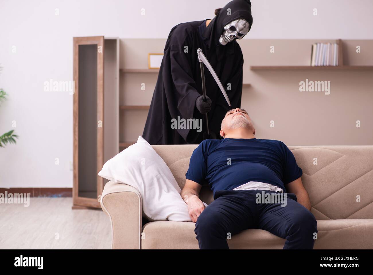 Devil coming to old dying man Stock Photo - Alamy
