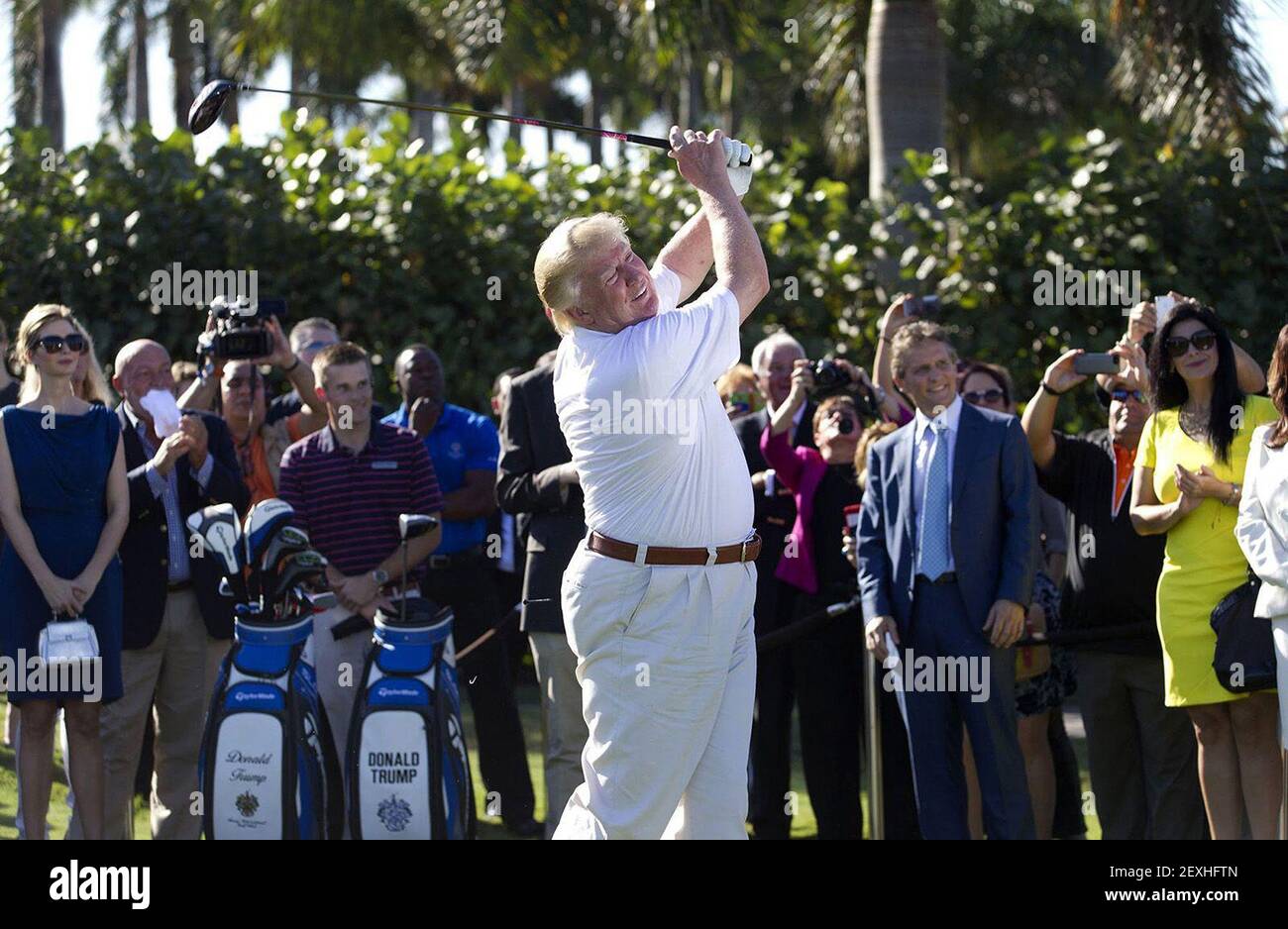 Donald Trump shows off his updated golf course by hitting a ceremonial tee shot off the 1st tee ...