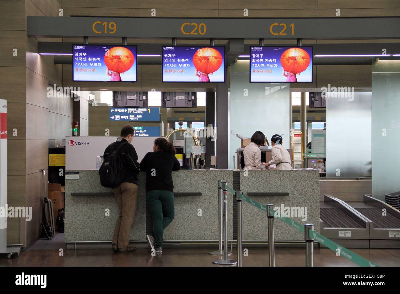Passengers check in at the counter of China Southern Airlines at the ...