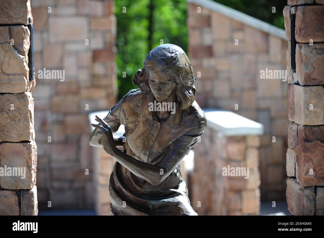A life-size bronze statue of Anne Frank by sculptor Greg Stone made to ...