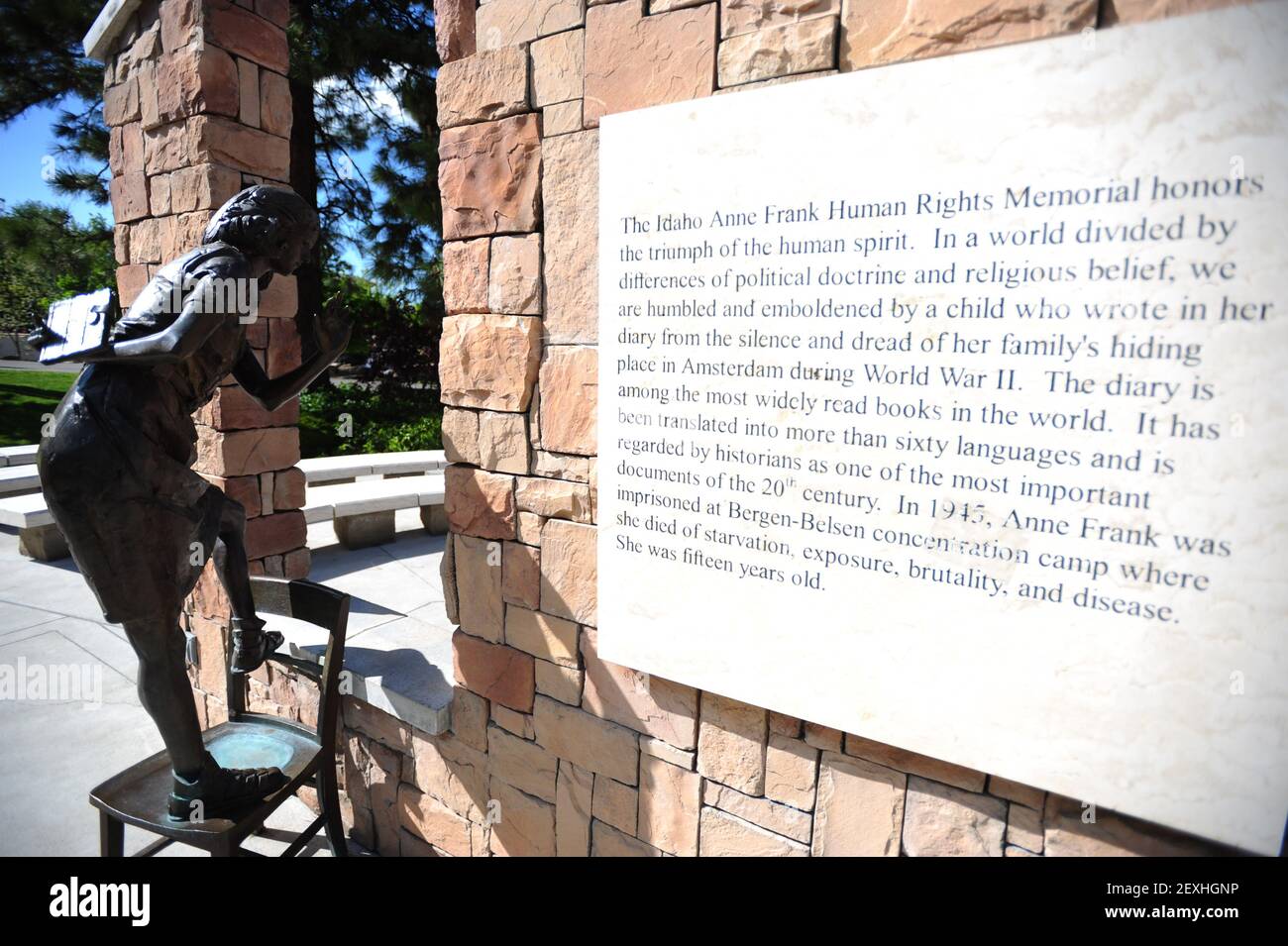 A life-size bronze statue of Anne Frank by sculptor Greg Stone made to ...
