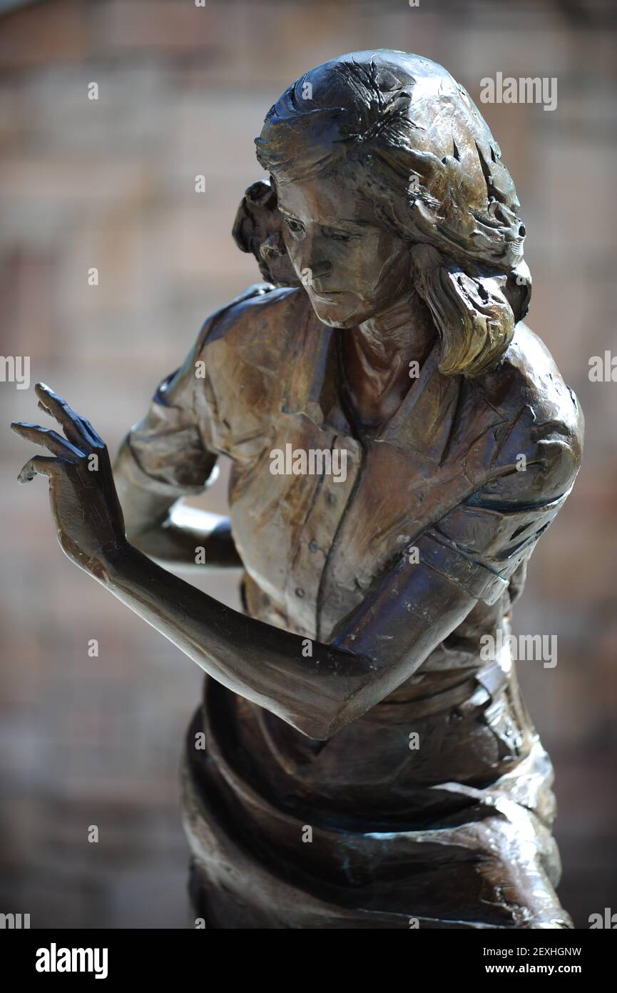 A life-size bronze statue of Anne Frank by sculptor Greg Stone made to ...