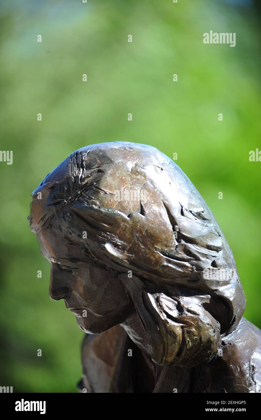 A life-size bronze statue of Anne Frank by sculptor Greg Stone made to ...
