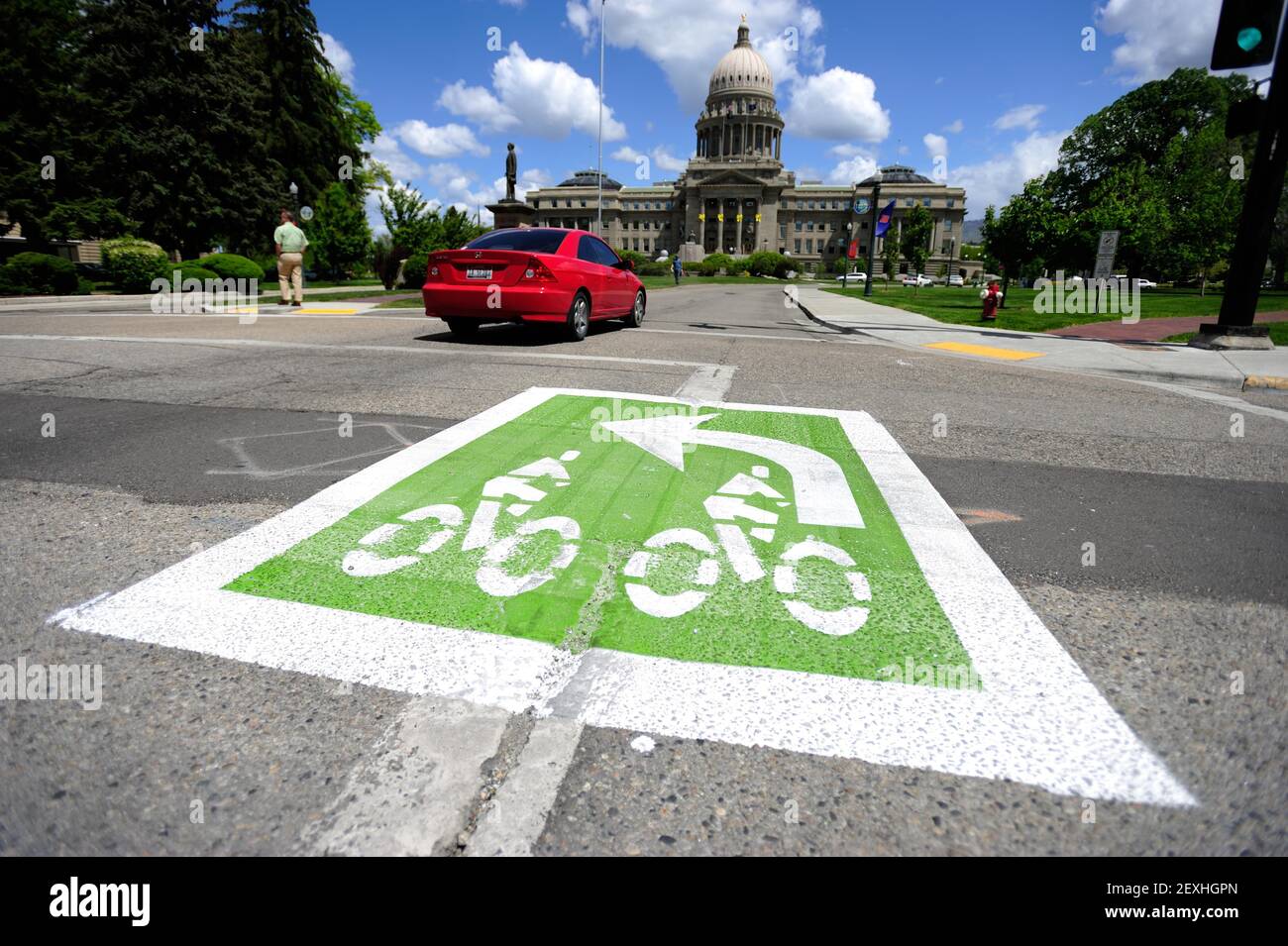 A green left turn bike box in front of the Idaho State Capitol pictured ...