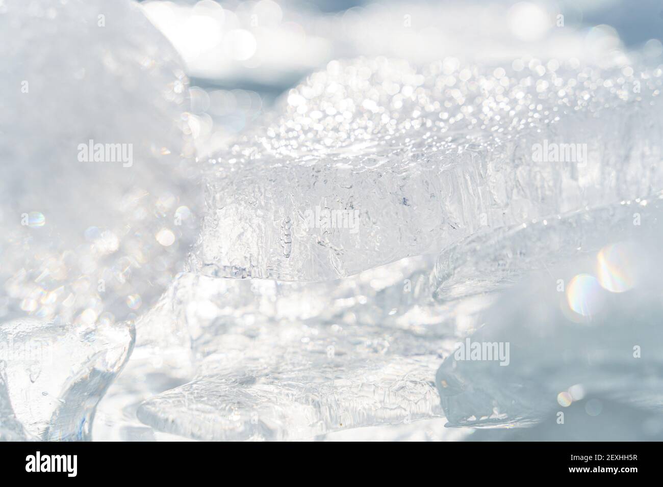 A closeup of transparent shining clear ice pieces sparkling from the ...