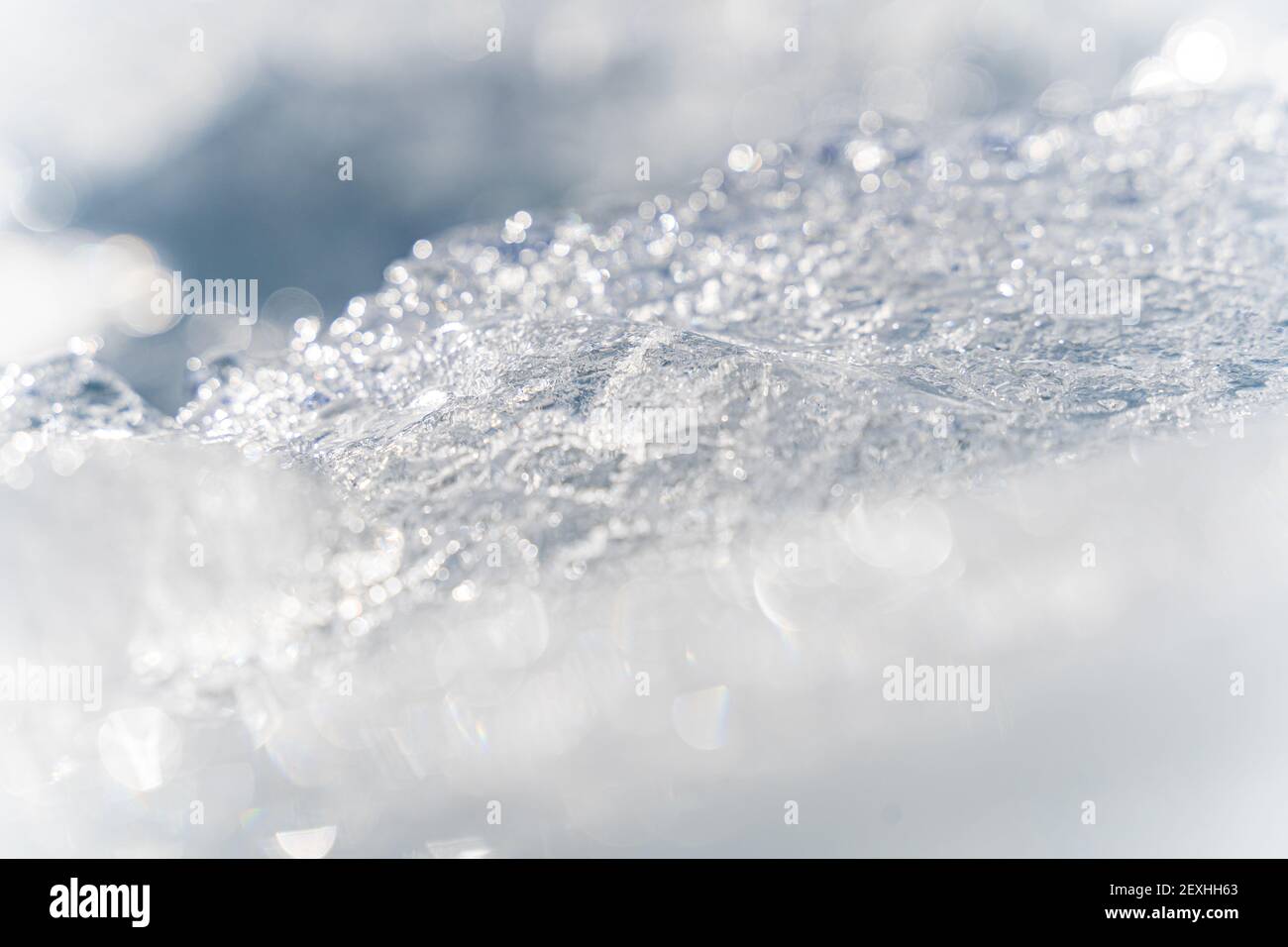 A closeup of transparent shining clear ice pieces sparkling from the ...