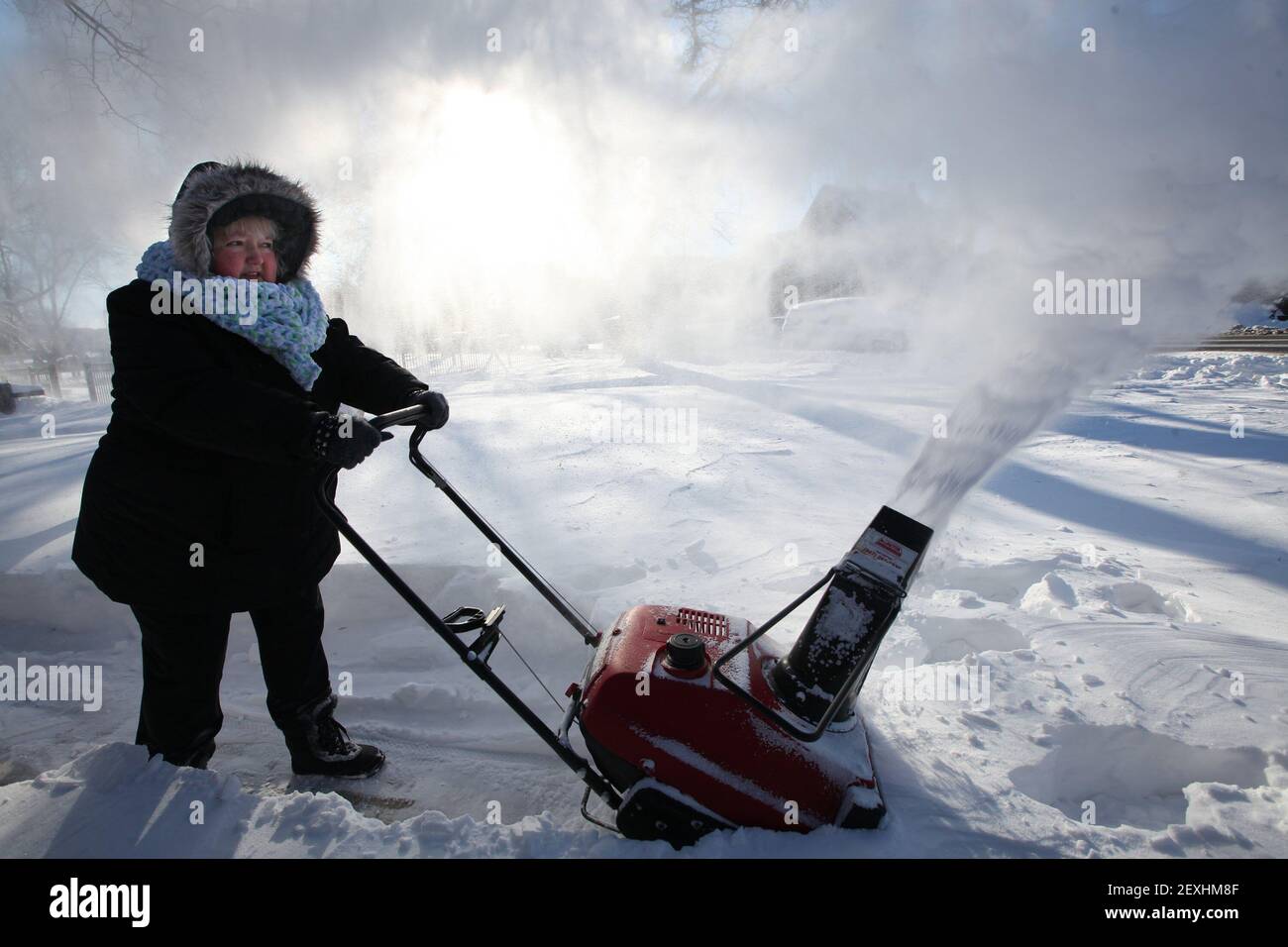 Teresa Wooldridge has a hard time finding the path to clear snow in ...