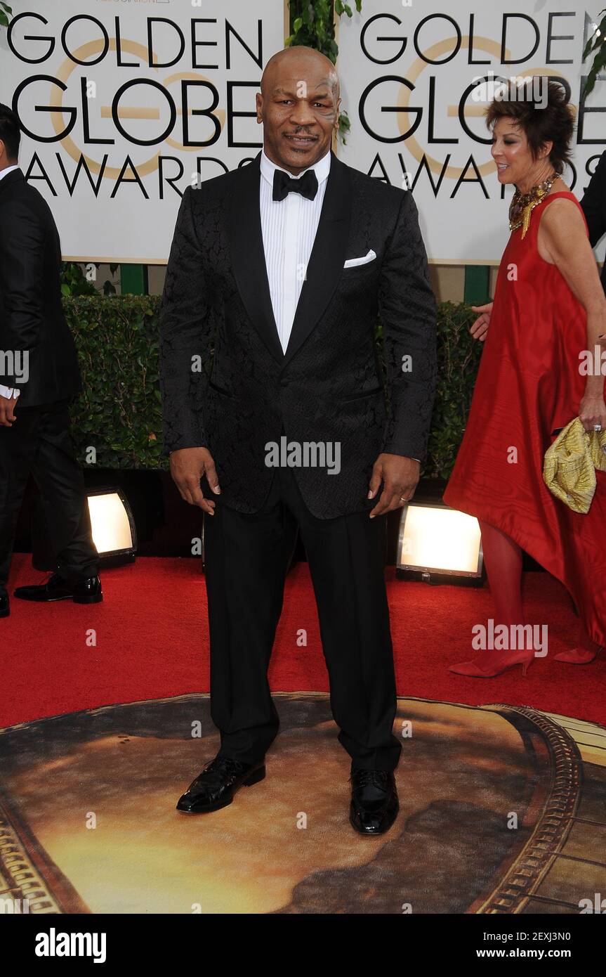 Boxer Mike Tyson arrives at the 71st Annual Golden Globe Awards held at ...