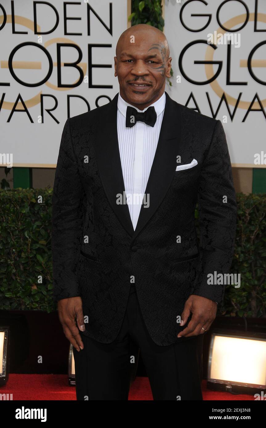 Boxer Mike Tyson arrives at the 71st Annual Golden Globe Awards held at ...