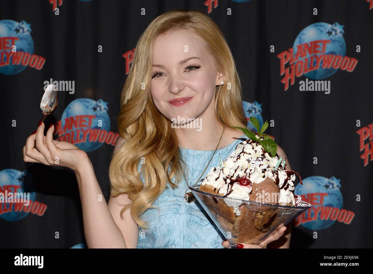 Actress Dove Cameron smiles as she eats an ice-cream sunday at Planet ...