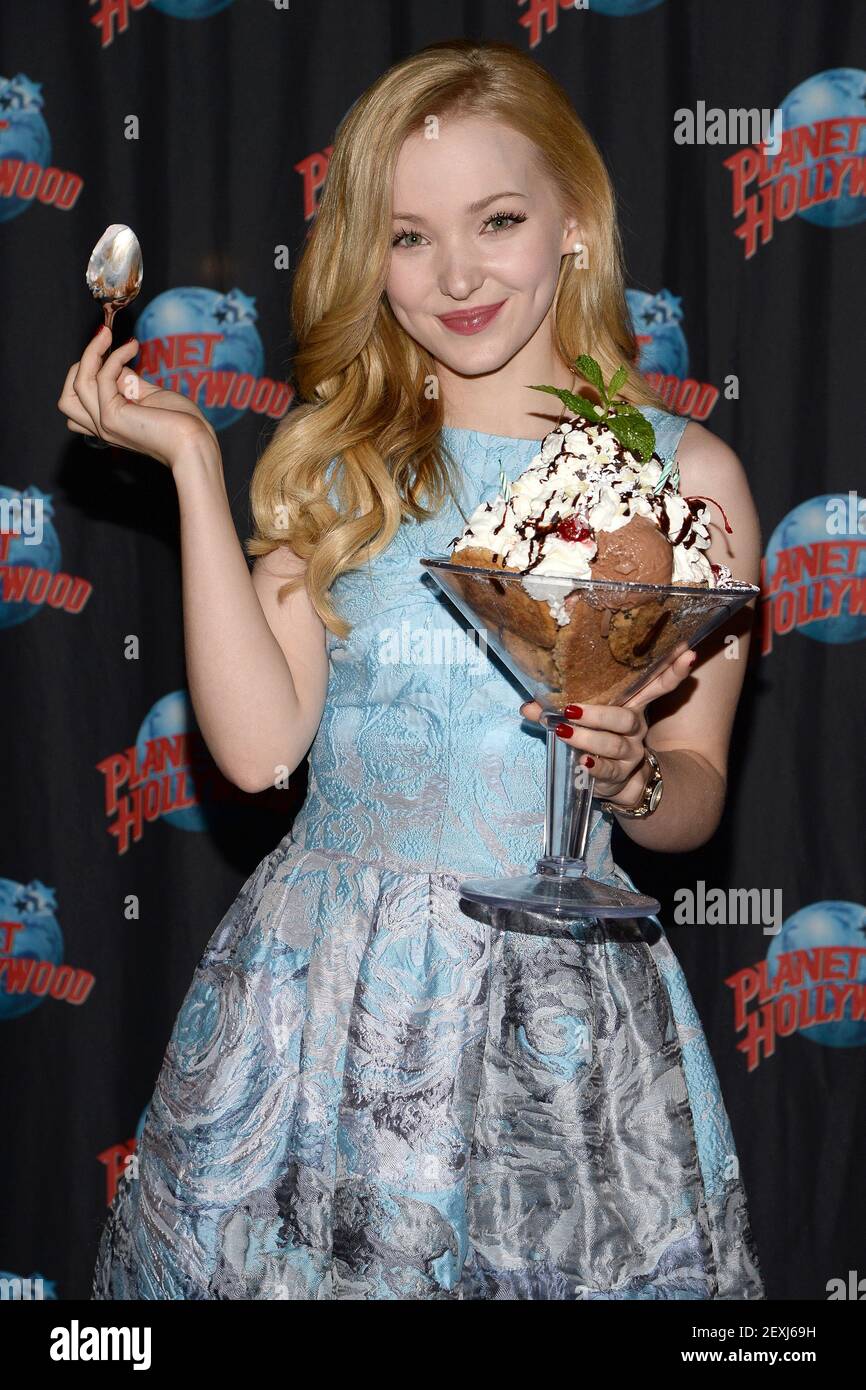 Actress Dove Cameron smiles as she eats an ice-cream sunday at Planet ...