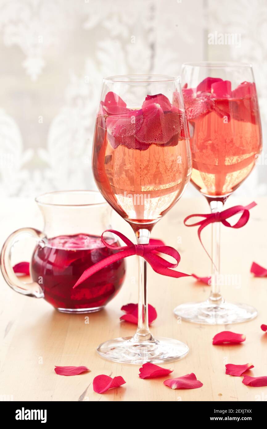 Cocktail with fresh rose petals Stock Photo - Alamy
