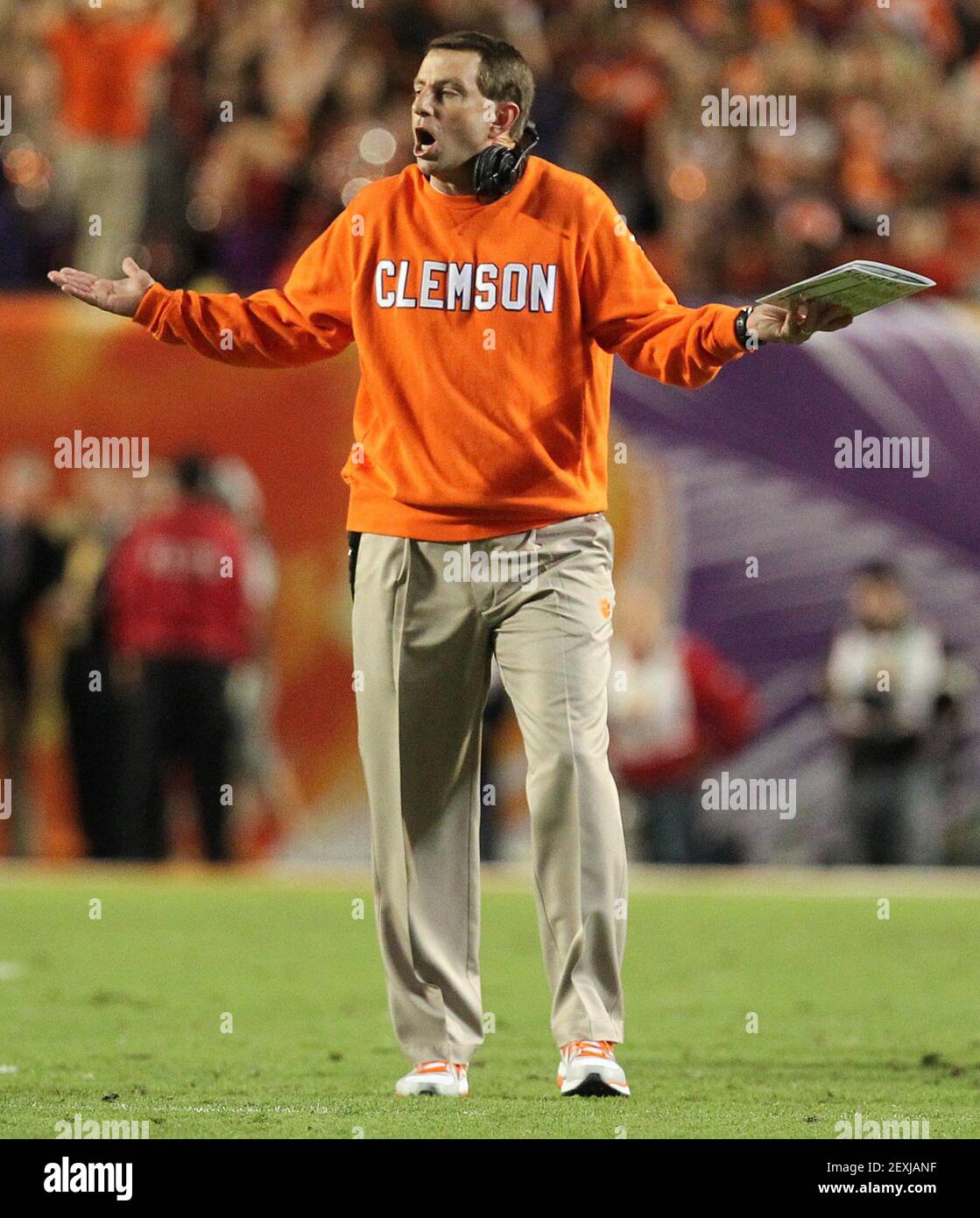 Clemson head coach Dabo Swinney gestures from the field in the first ... Clemson head coach Dabo Swinney gestures from the field in the first ...