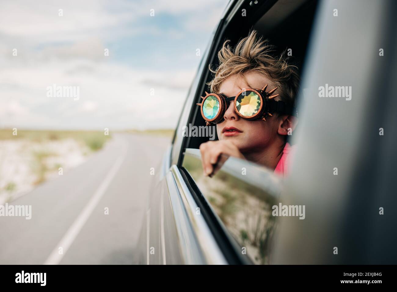 My son looking out the car window on a long road trip while wearing his ...