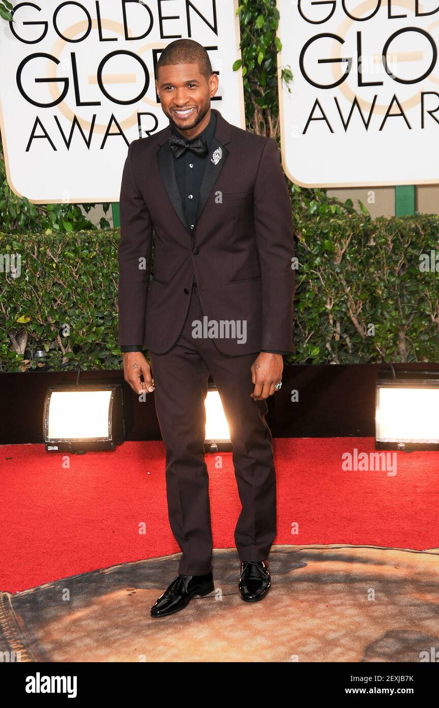 Singer Usher arrives at the 71st Annual Golden Globe Awards held at the ...