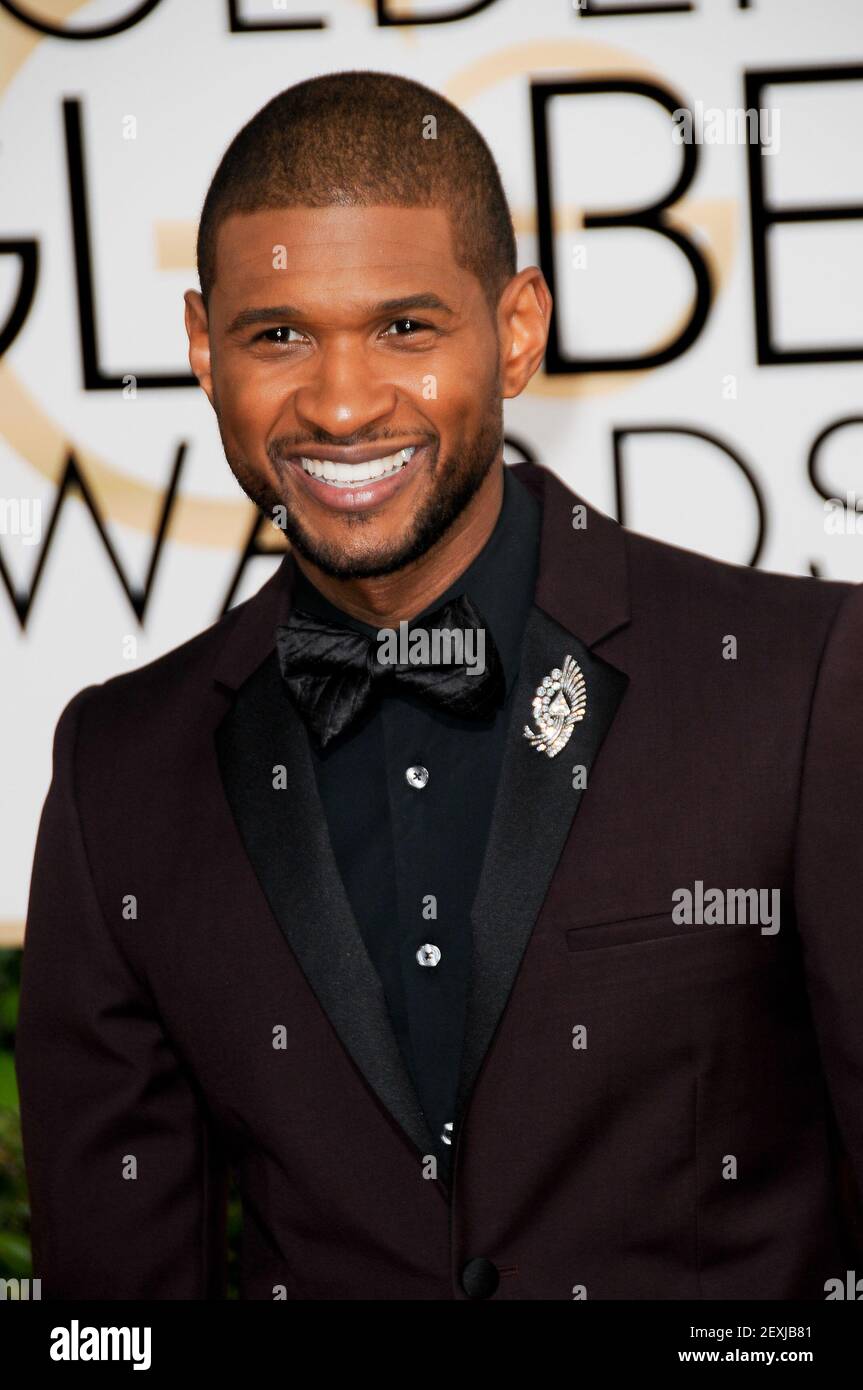 Singer Usher arrives at the 71st Annual Golden Globe Awards held at the ...