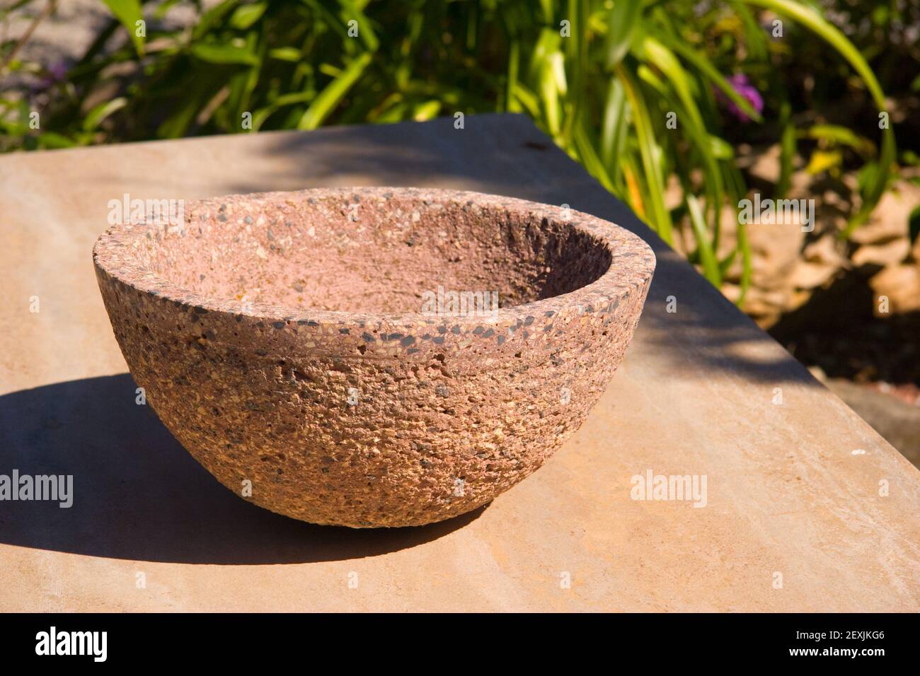 Stone bowl in the garden Stock Photo - Alamy