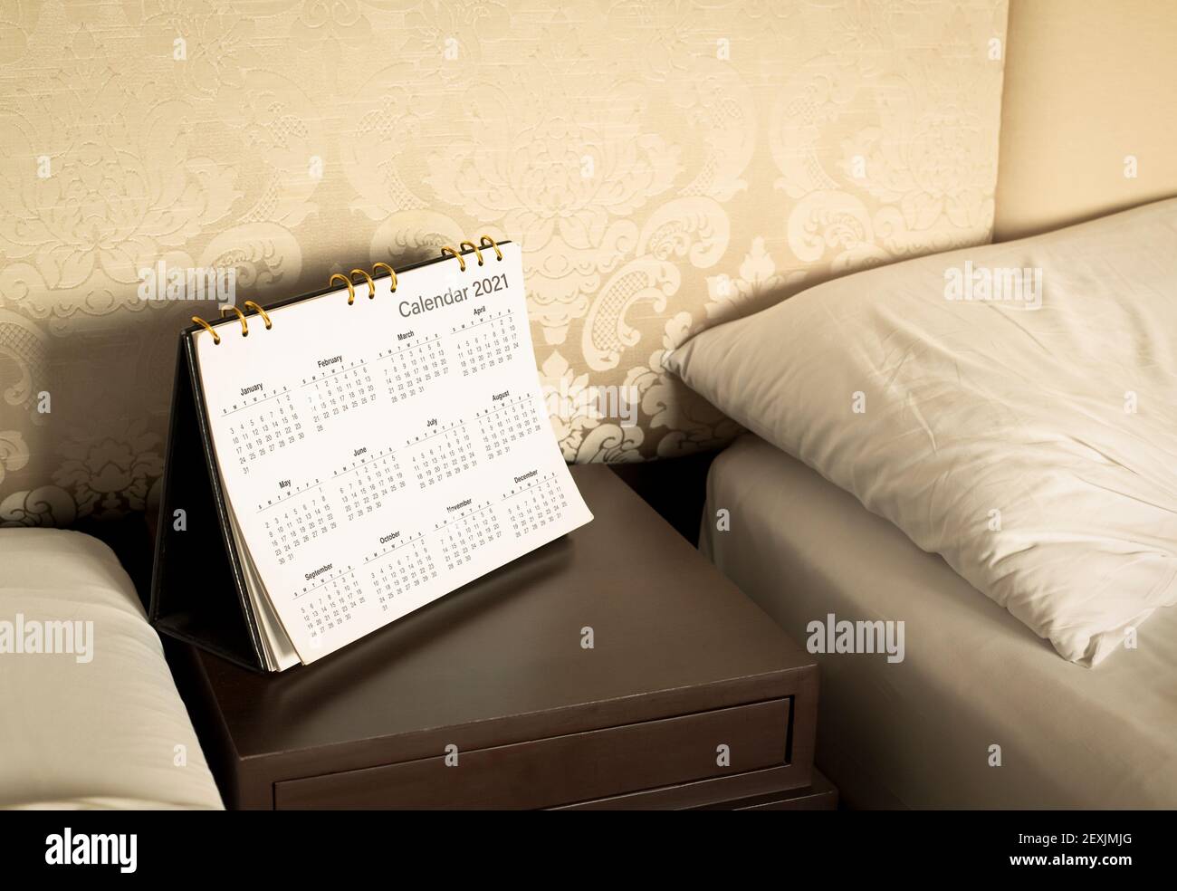 Desk calendar diary on hotel office table with year 2021 work place ...