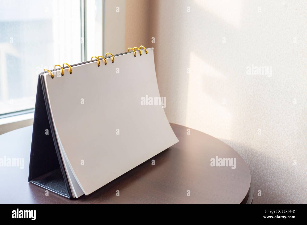 Desk calendar diary on hotel office table with year 2021 work place ...