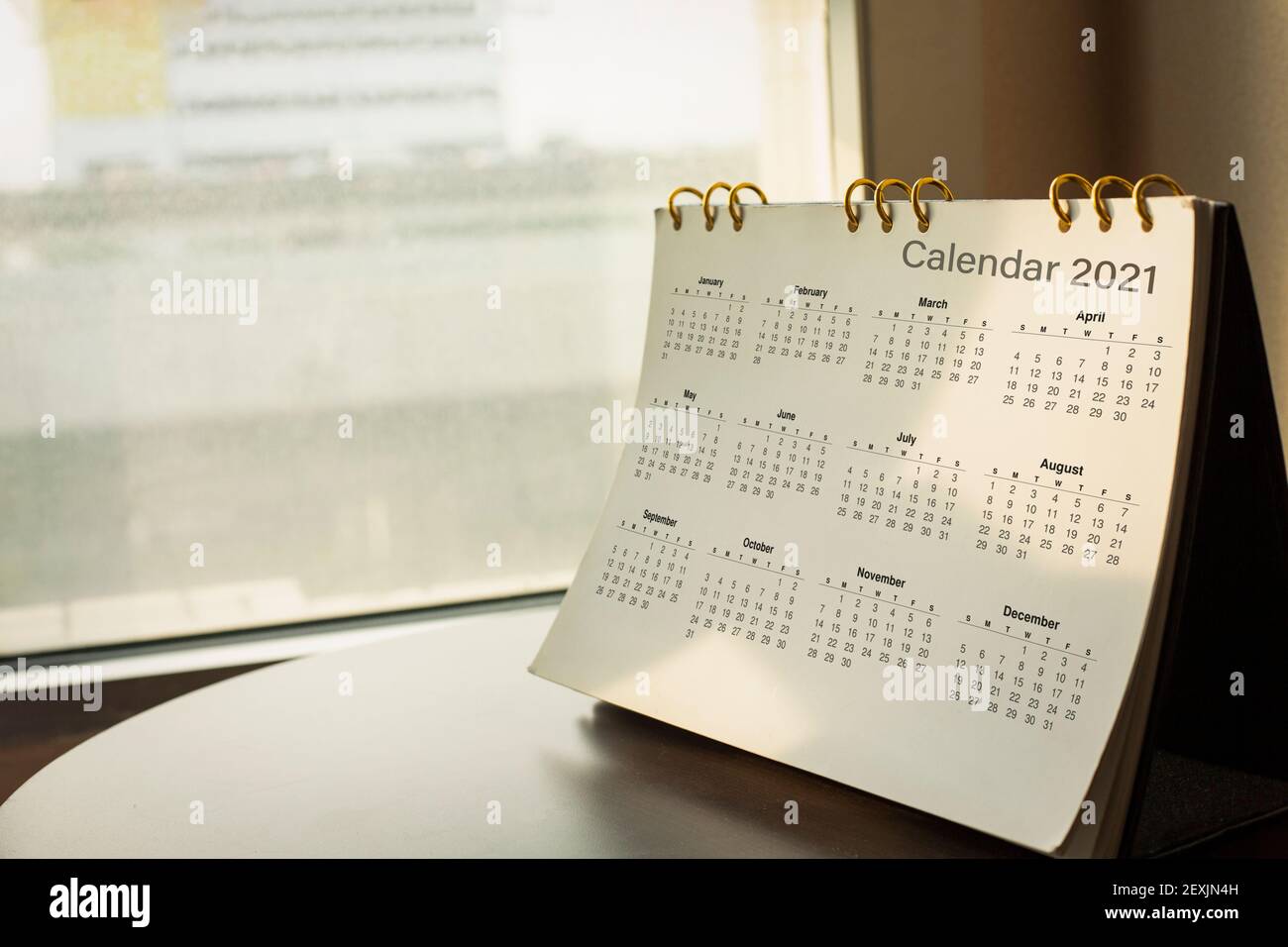 Desk calendar diary on hotel office table with year 2021 work place ...
