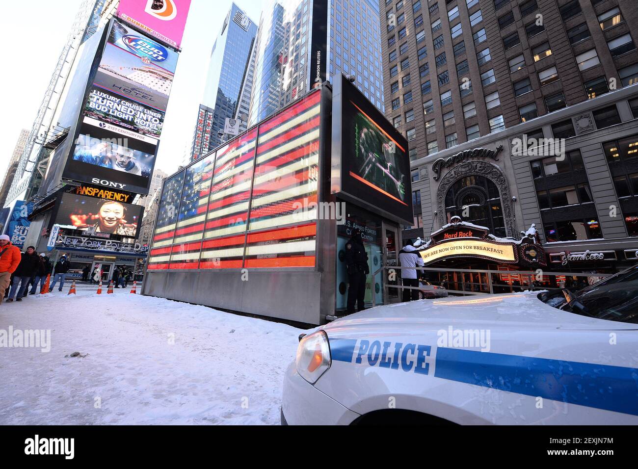 NYPD squad cars covered in snow and ice are parked in Times Square the ...