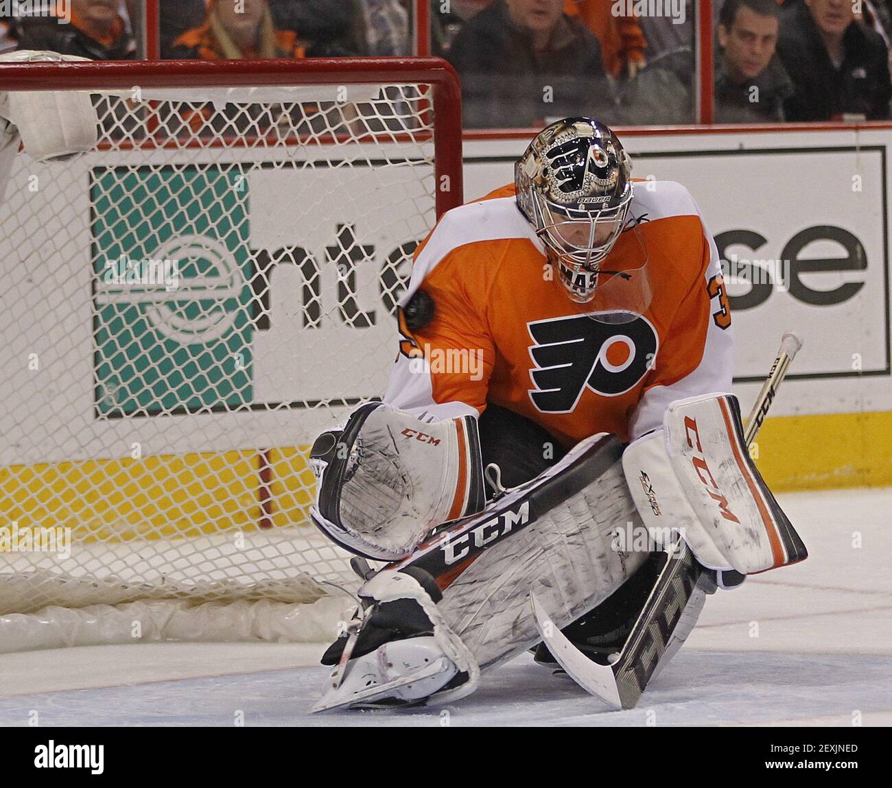 Philadelphia Flyers goalie Steve Mason is unable to stop a shot from ...
