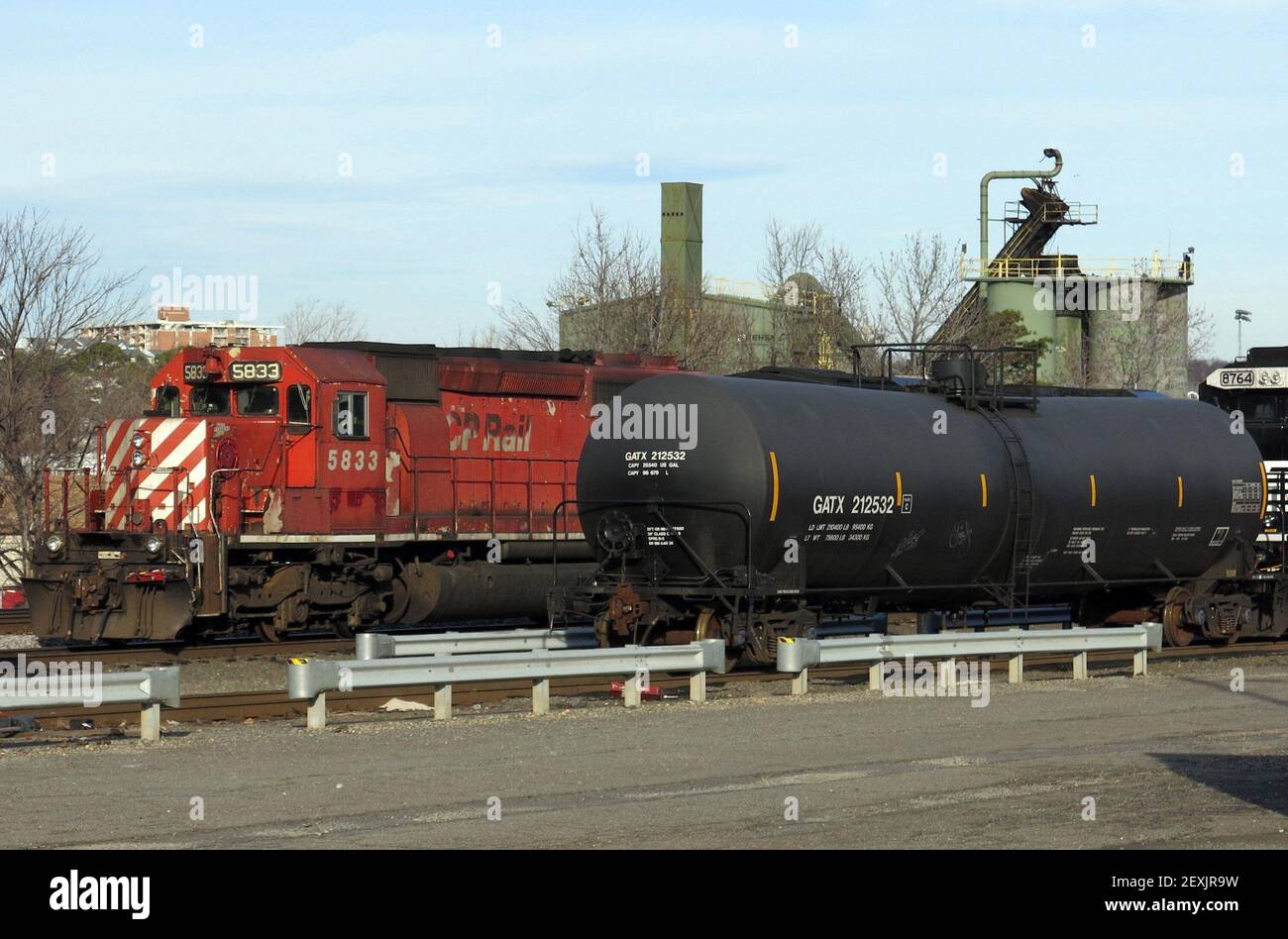 A railroad tank car is surrounded by locomotives in the Norfolk ...