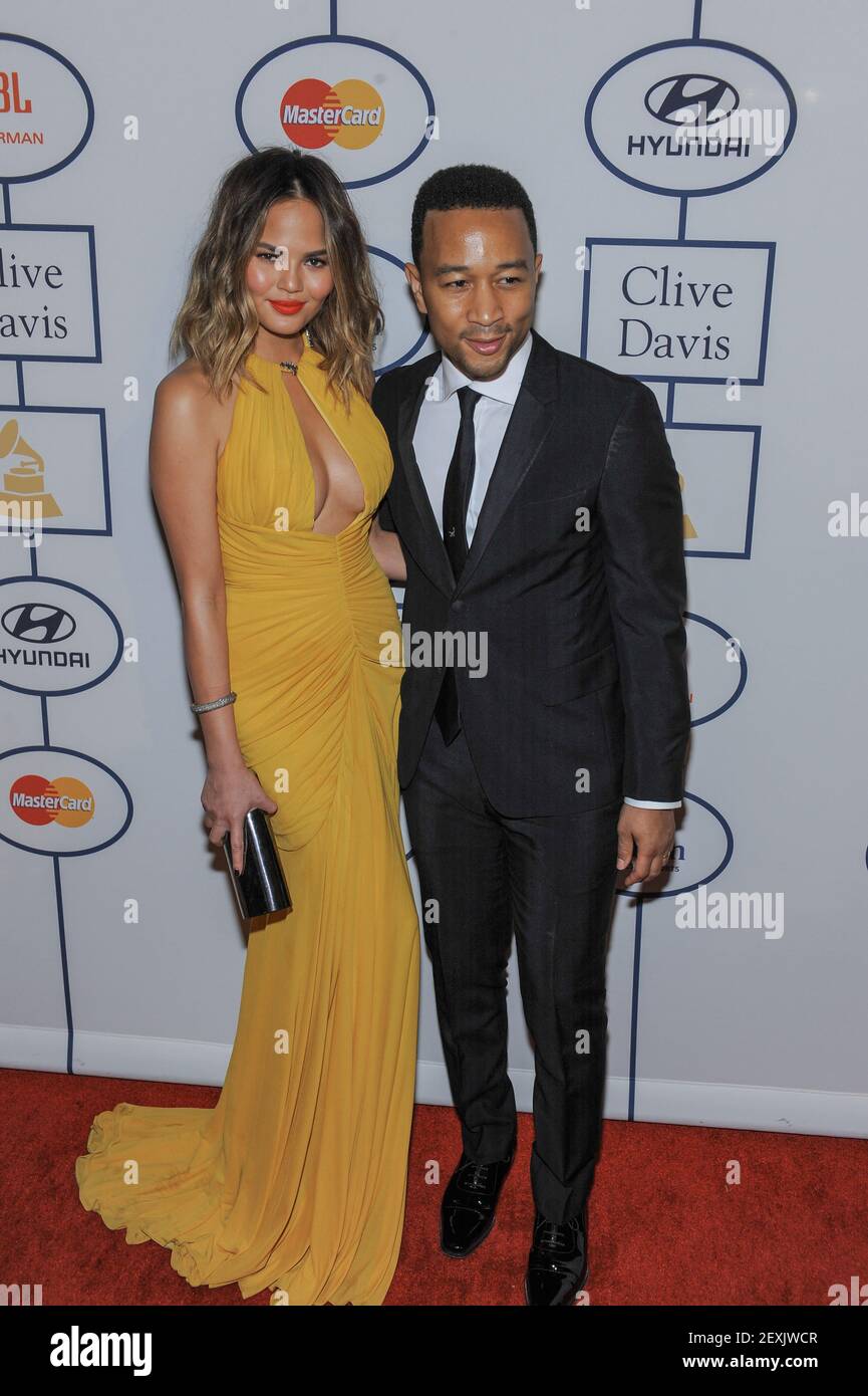 Singer John Legend and his wife Chrissy Tiegen arrives at the 2014 Clive Davis Annual Gala held ...