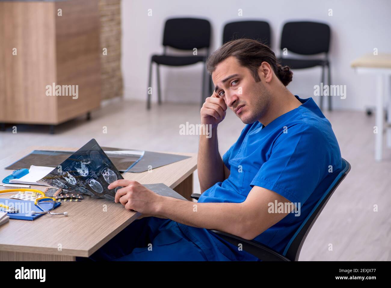 Young doctor radiologist being unhappy after night shift Stock Photo ...