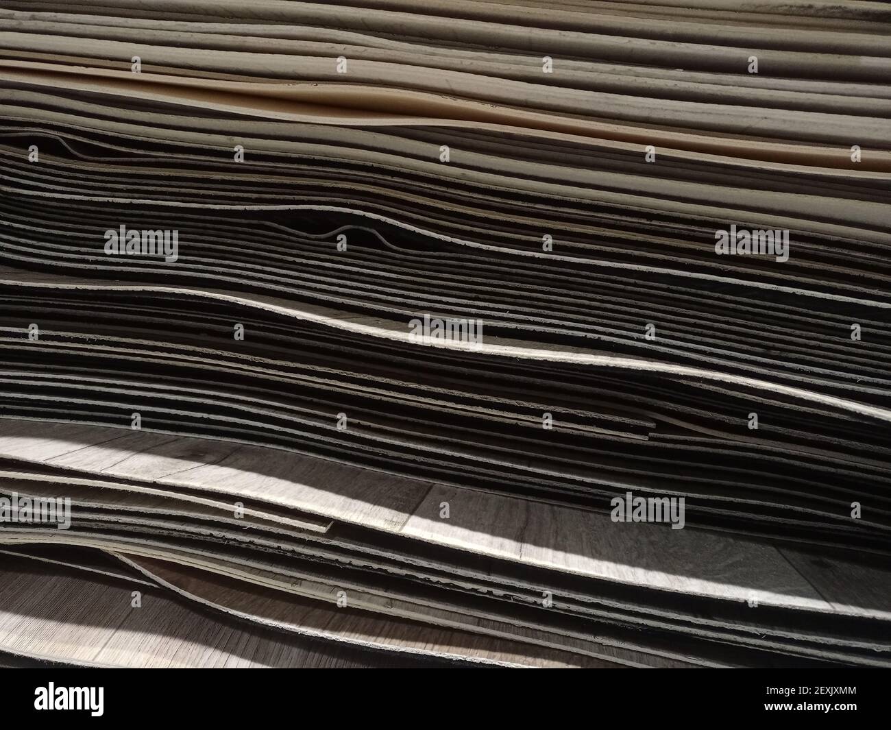 A pile of remnants of pieces of linoleum stacked on top of each other ...