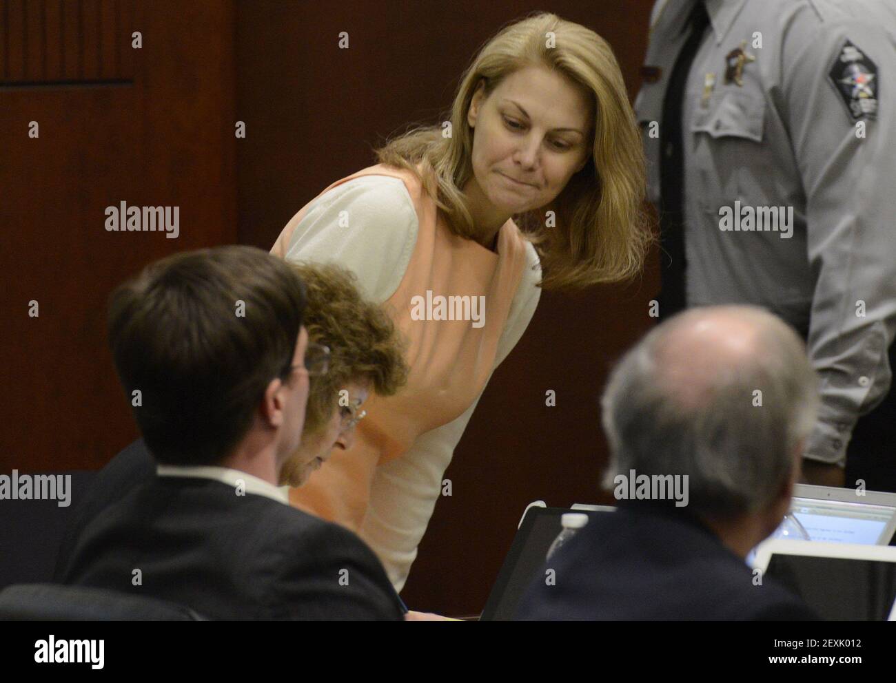 Defendant Amanda Hayes, center, takes her seat for opening statements ...